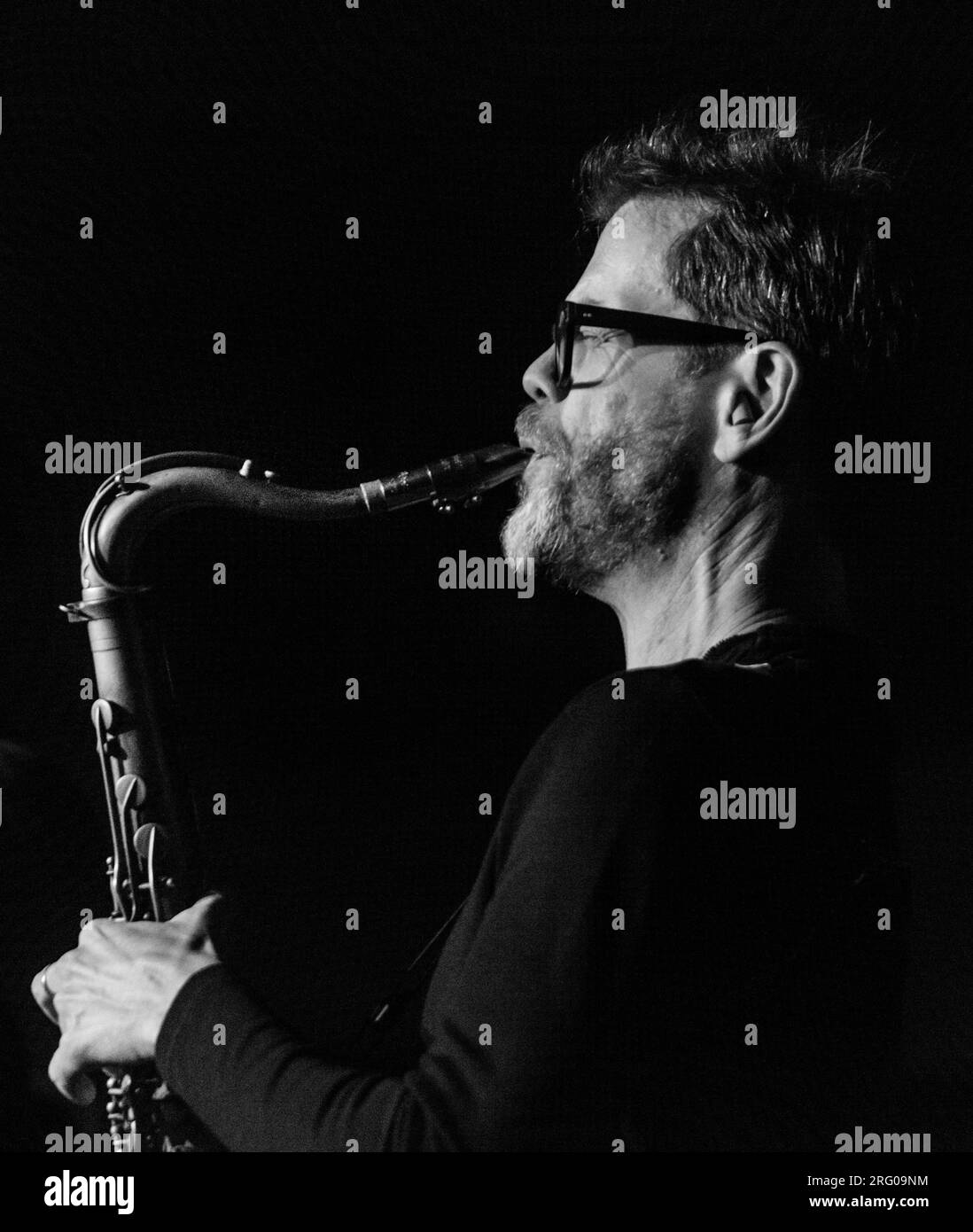 Blowing horns at festival Black and White Stock Photos & Images - Alamy