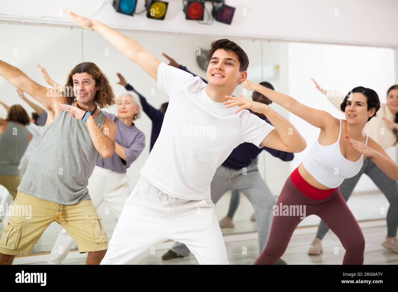 Group of adult people practices dance aerobics Stock Photo - Alamy