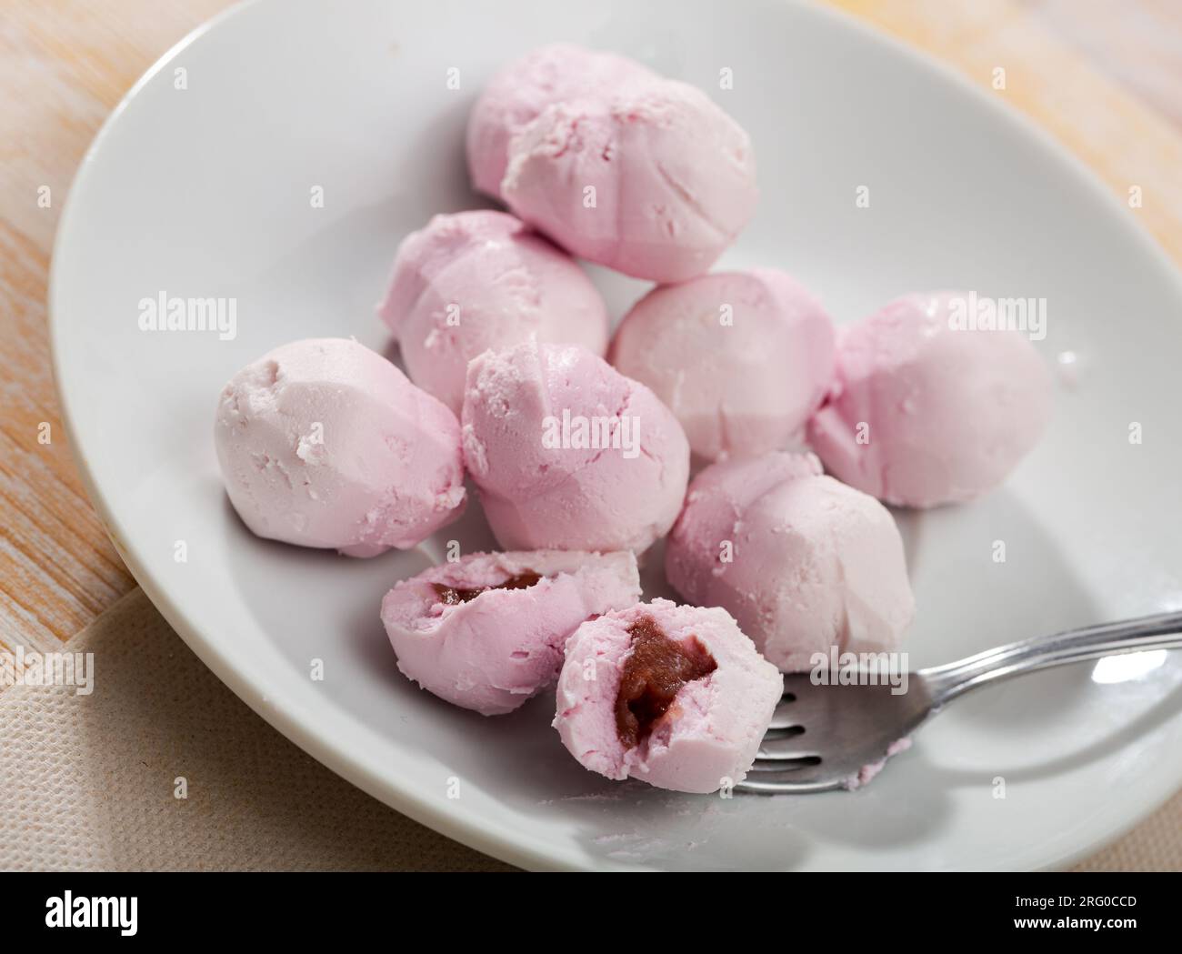 Goat cheese pearls with raspberries Stock Photo - Alamy