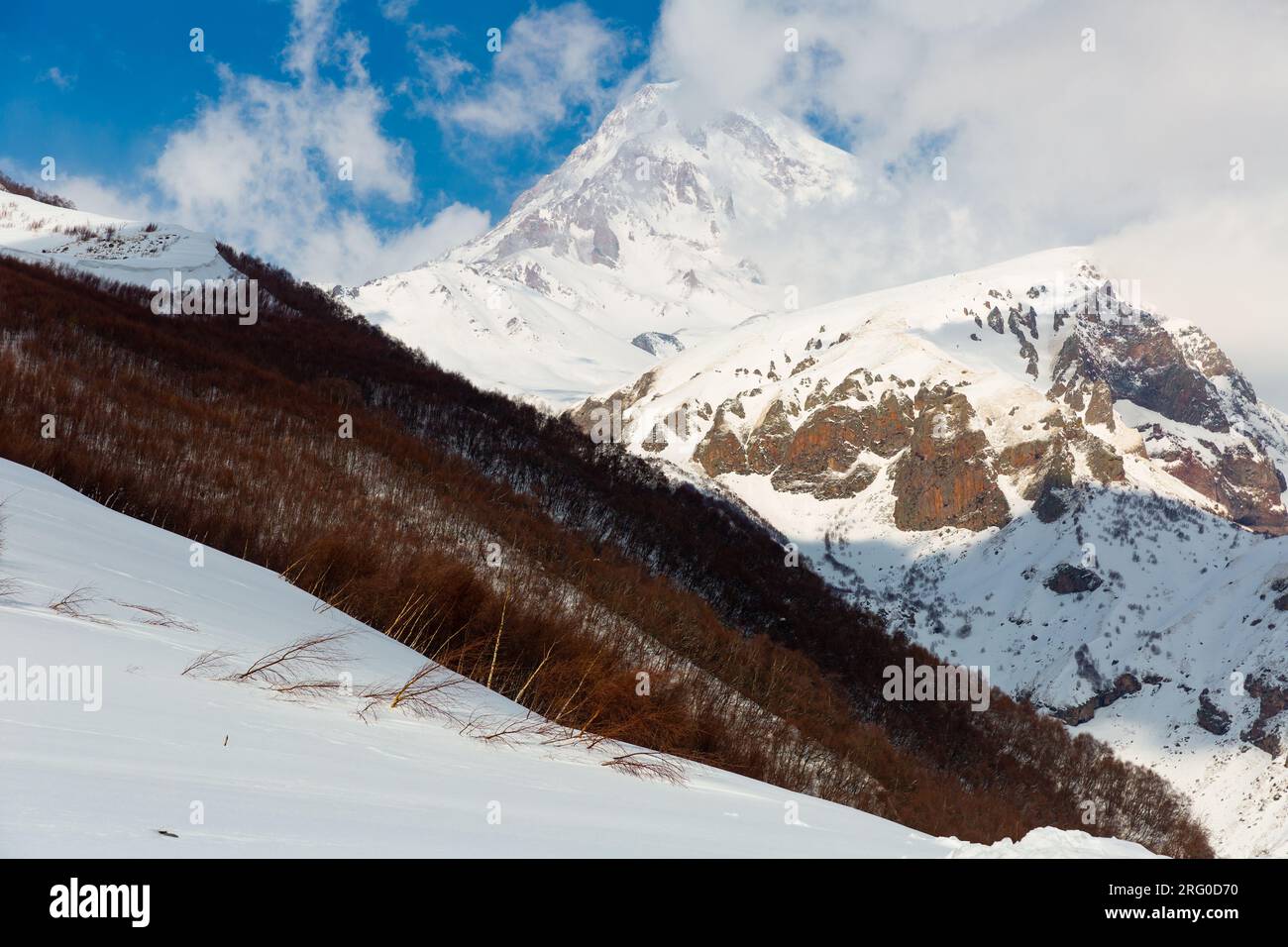 Mountain landscape of snow-capped Caucasus Range with Kazbek peak Stock ...