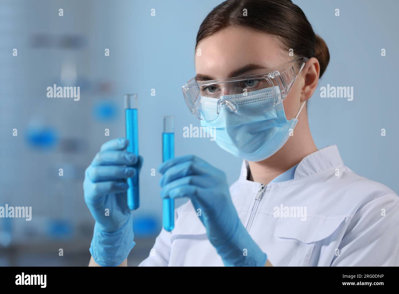 Scientist holding test tubes with samples in laboratory Stock Photo - Alamy