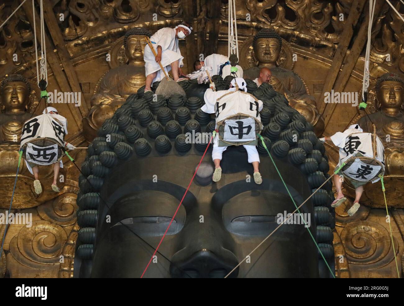 Approximately 170 monks, wear white clothes and straw sandals, brush ...