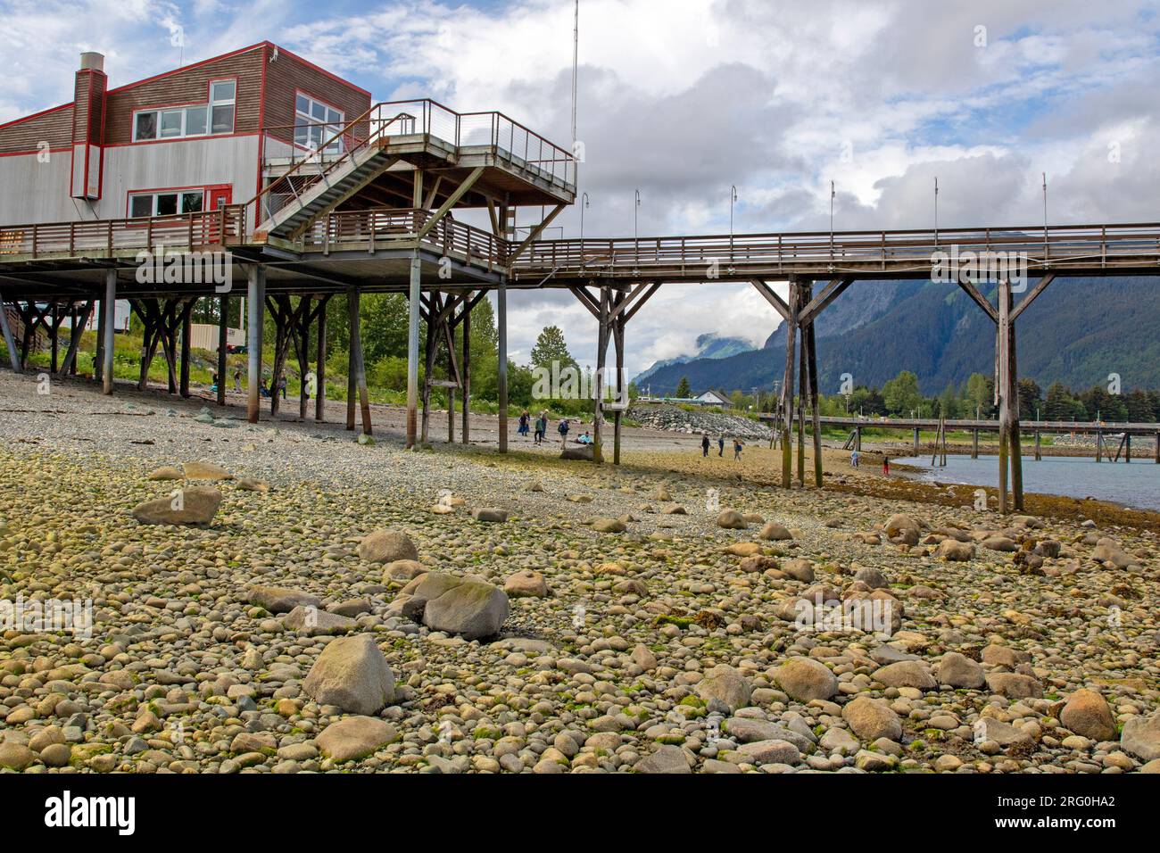 Pier and rocky beach at Haines Stock Photo - Alamy