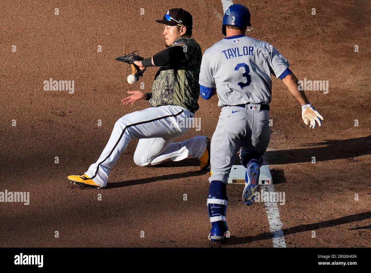 San Diego Padres first baseman Ji Man Choi, left, makes the catch for ...