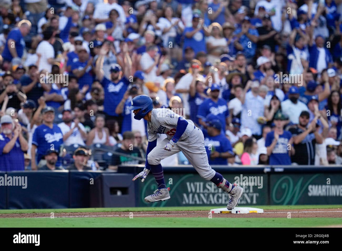 Los Angeles Dodgers' Mookie Betts rounds third base after hitting a ...