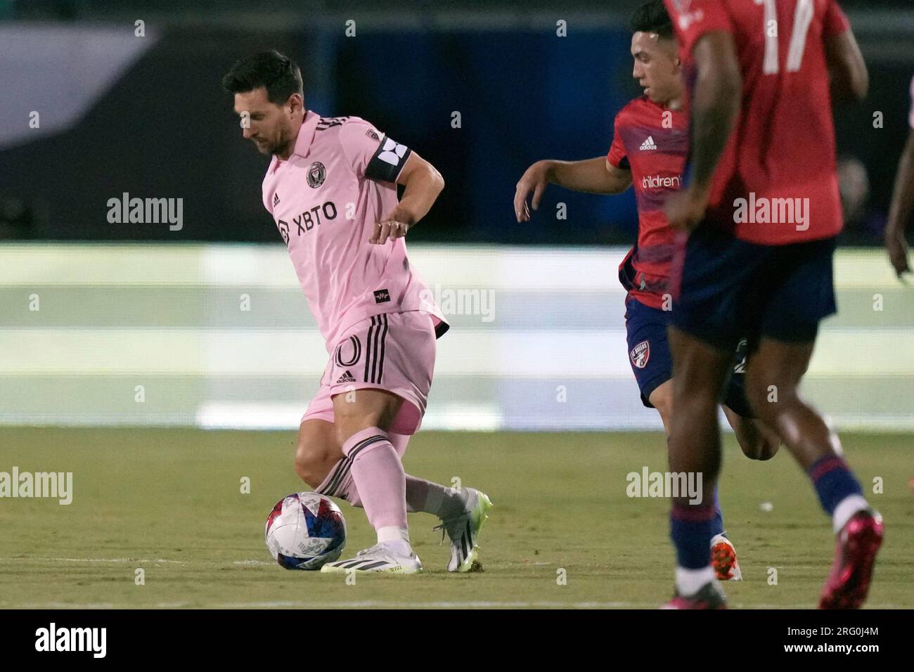 Inter Miami forward Lionel Messi (10) dribbles the ball next to FC ...