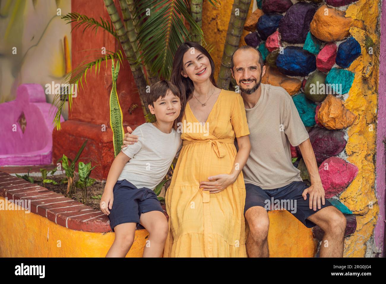 A loving couple in their 40s and their teenage son cherishing the ...