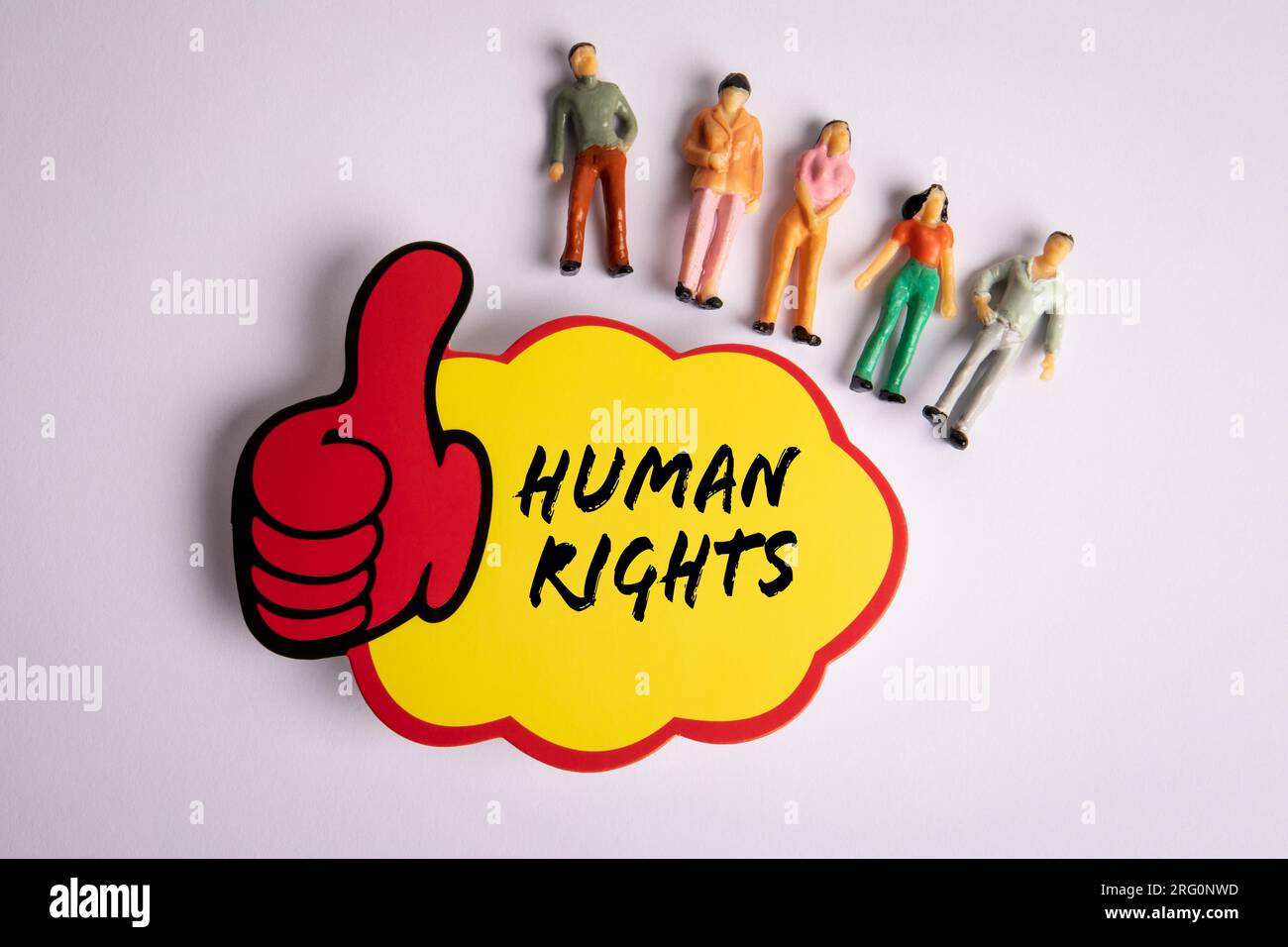 Human Rights. Sticky note with text and miniature human figures on a ...