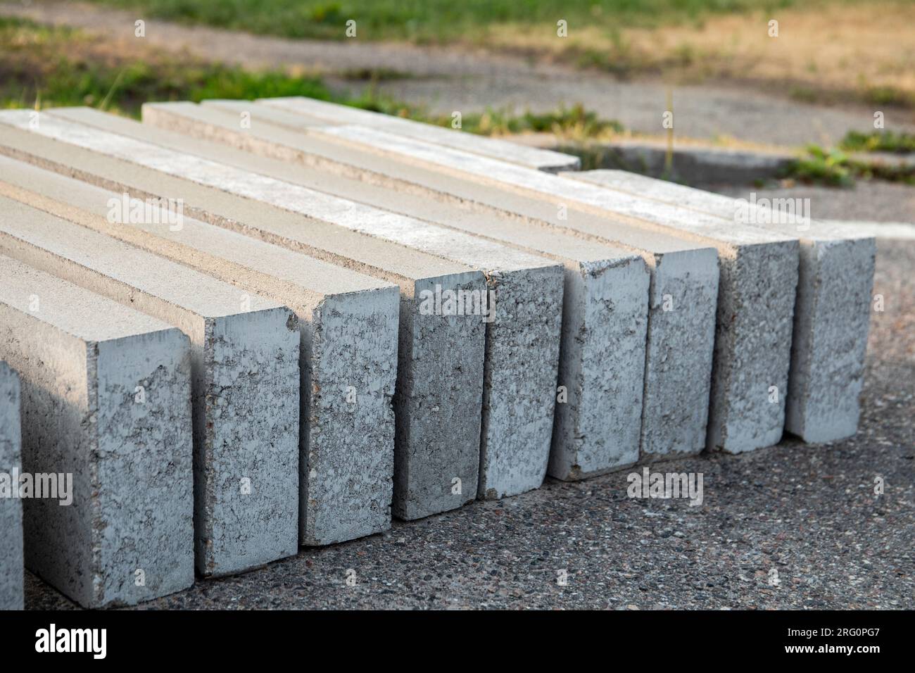 Concrete curbs stand on the street during street repair. Road works ...