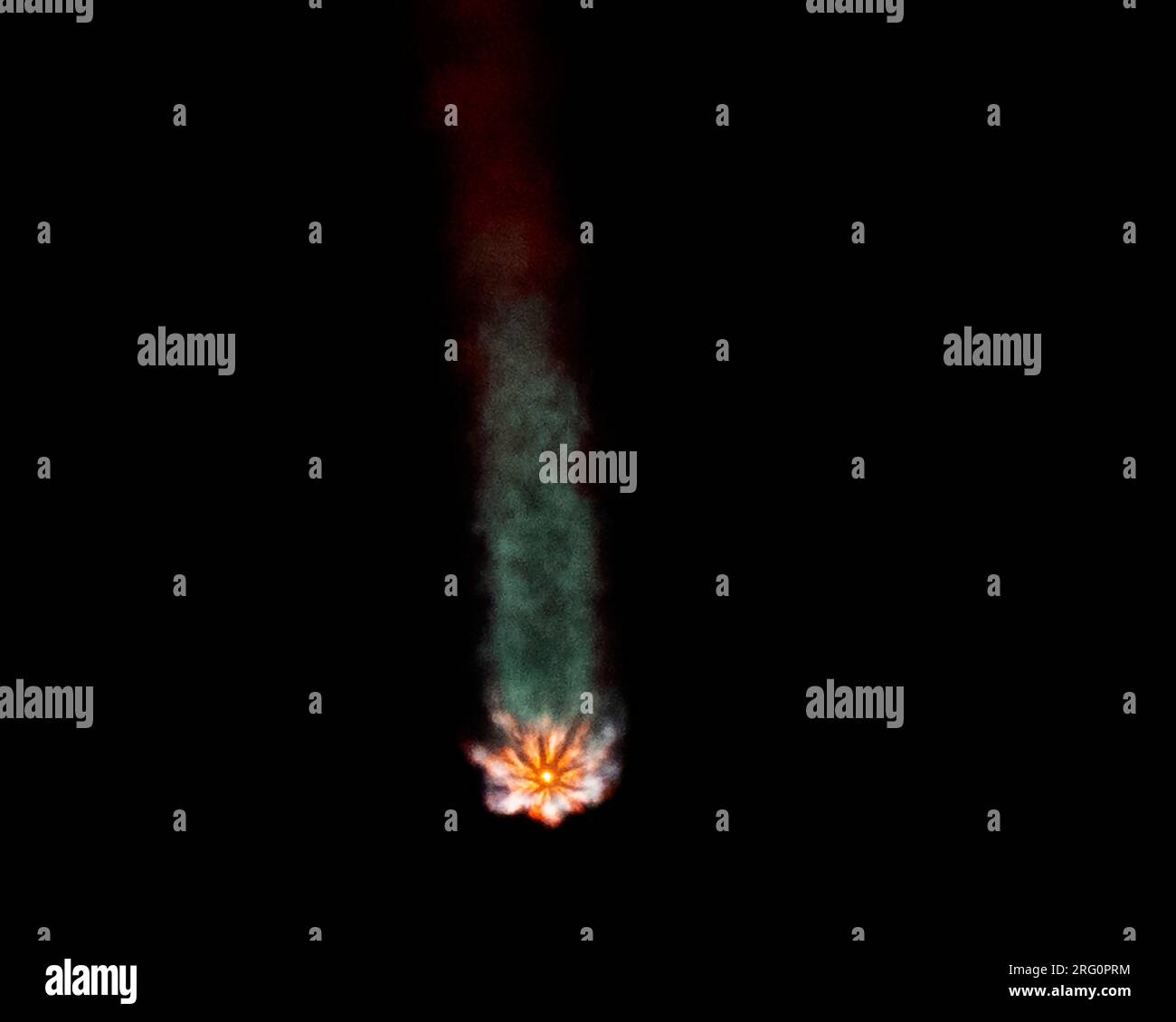 A SpaceX Falcon 9 rocket exhaust plume changes color at altitude as the ...