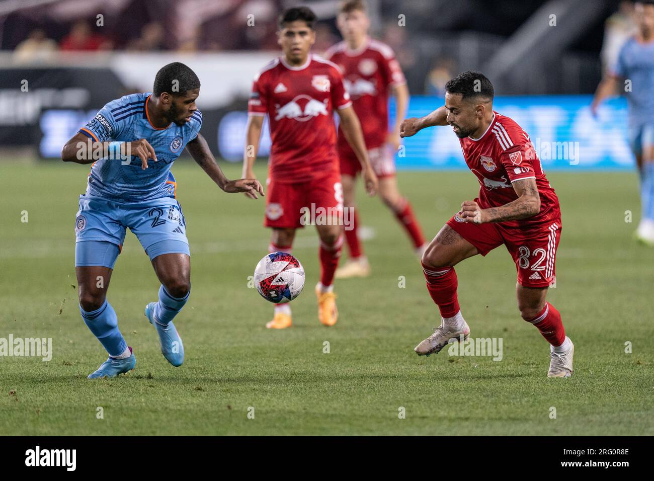 Tayvon Gray (24) of NYCFC and Luquinhas (82) of Red Bulls chase ball ...