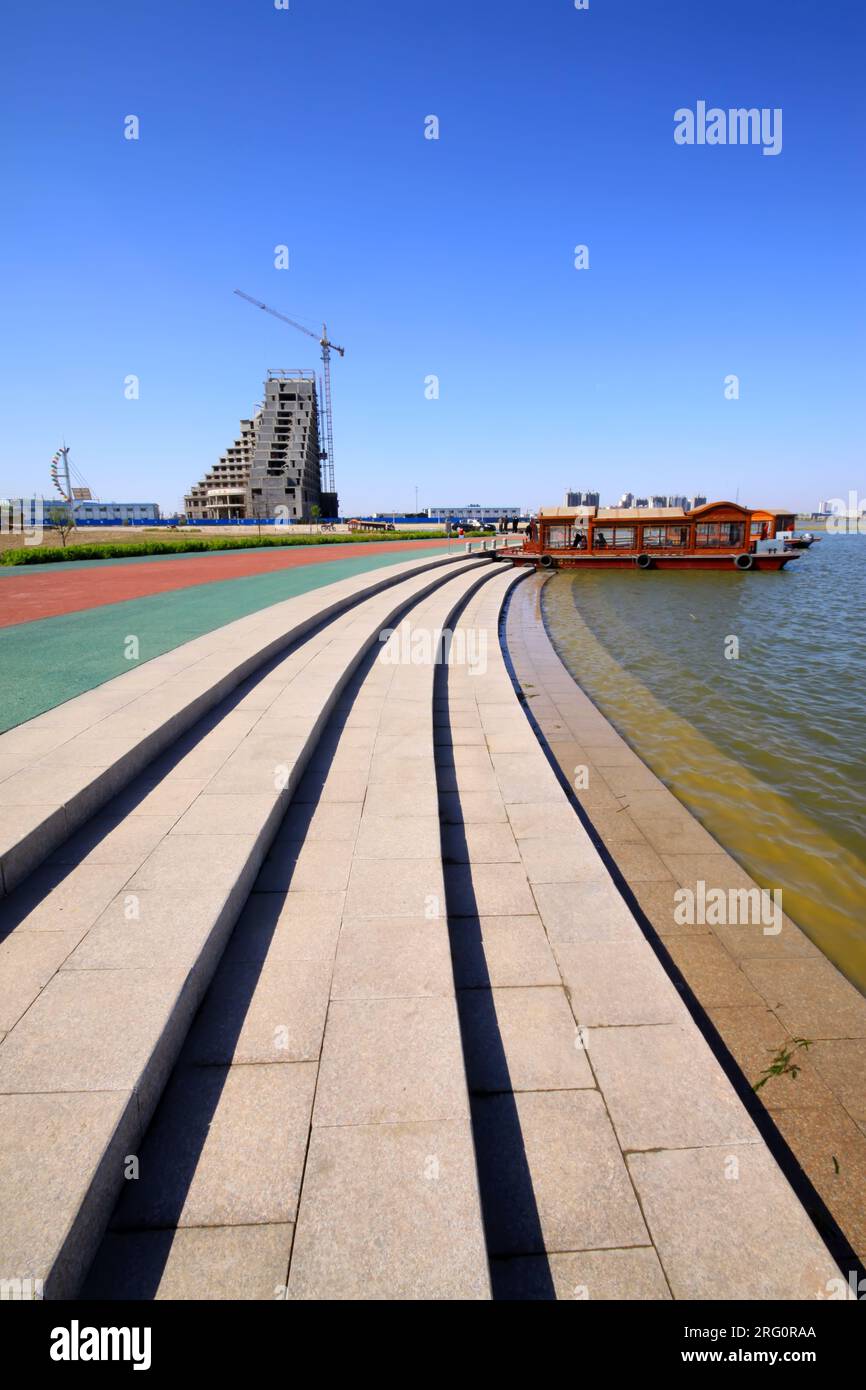 landscape architecture by the lake under the blue sky, Hengshui city ...