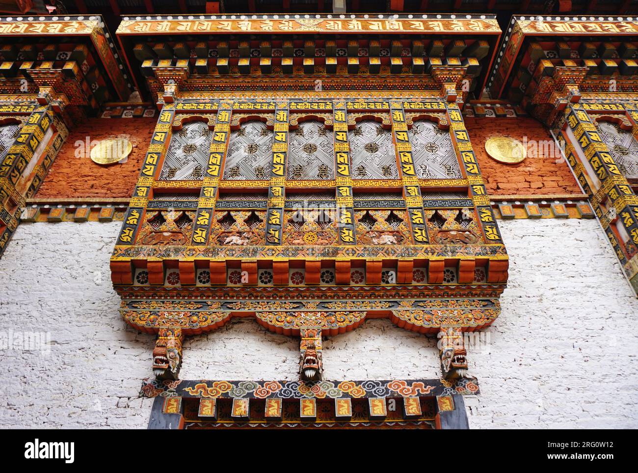 Looking up at a traditional painted wooden rabsel window projecting ...