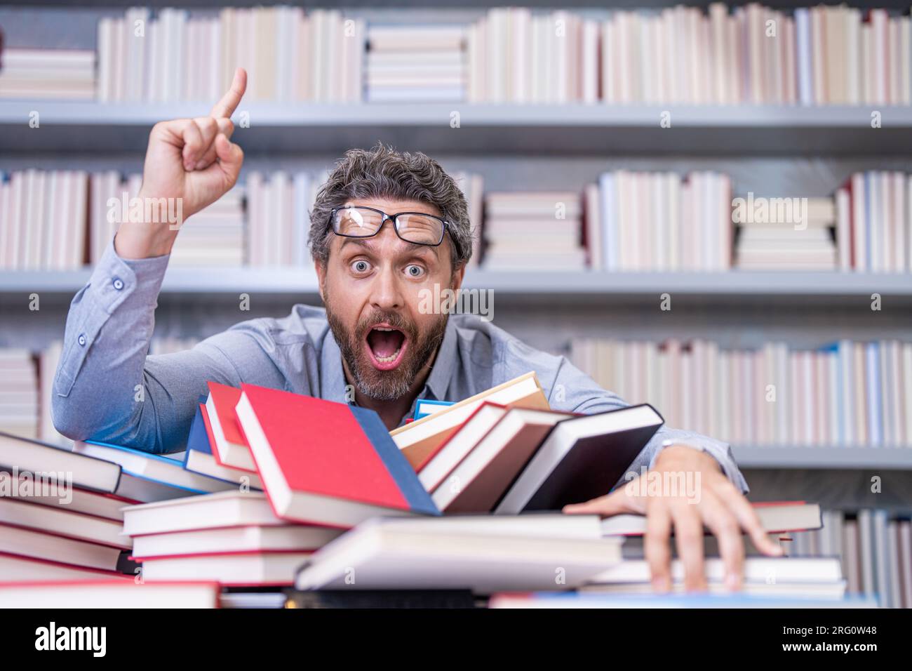 school teacher loves education. bookworm nerd in school library ...