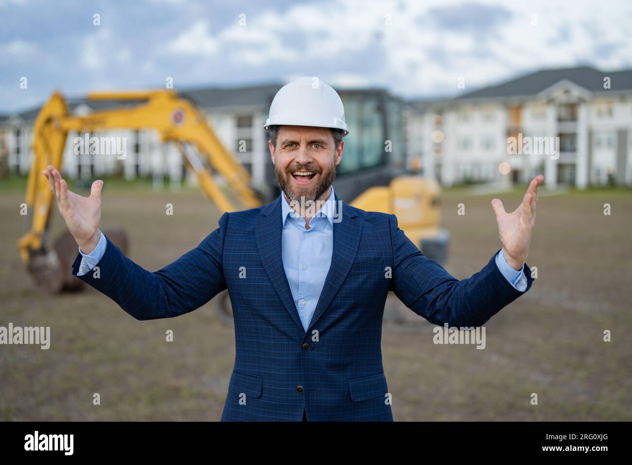 photo of glad successful construction business owner wearing hardhat ...
