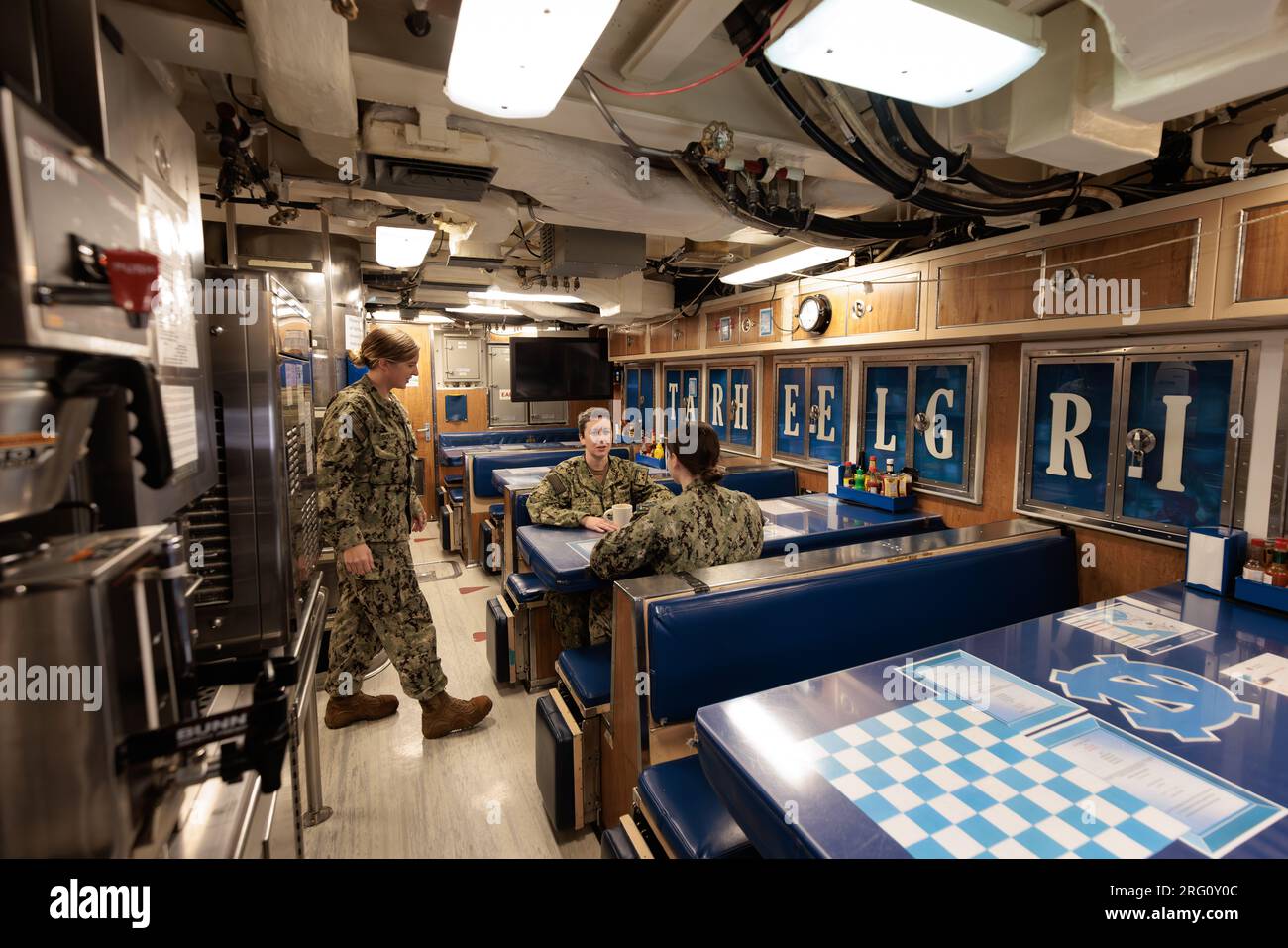Crew members are seen in the crews mess onboard the USS North Carolina ...