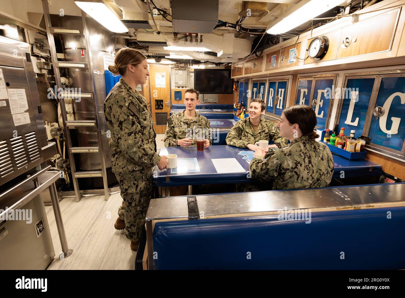 Crew members are seen in the crews mess onboard the USS North Carolina ...