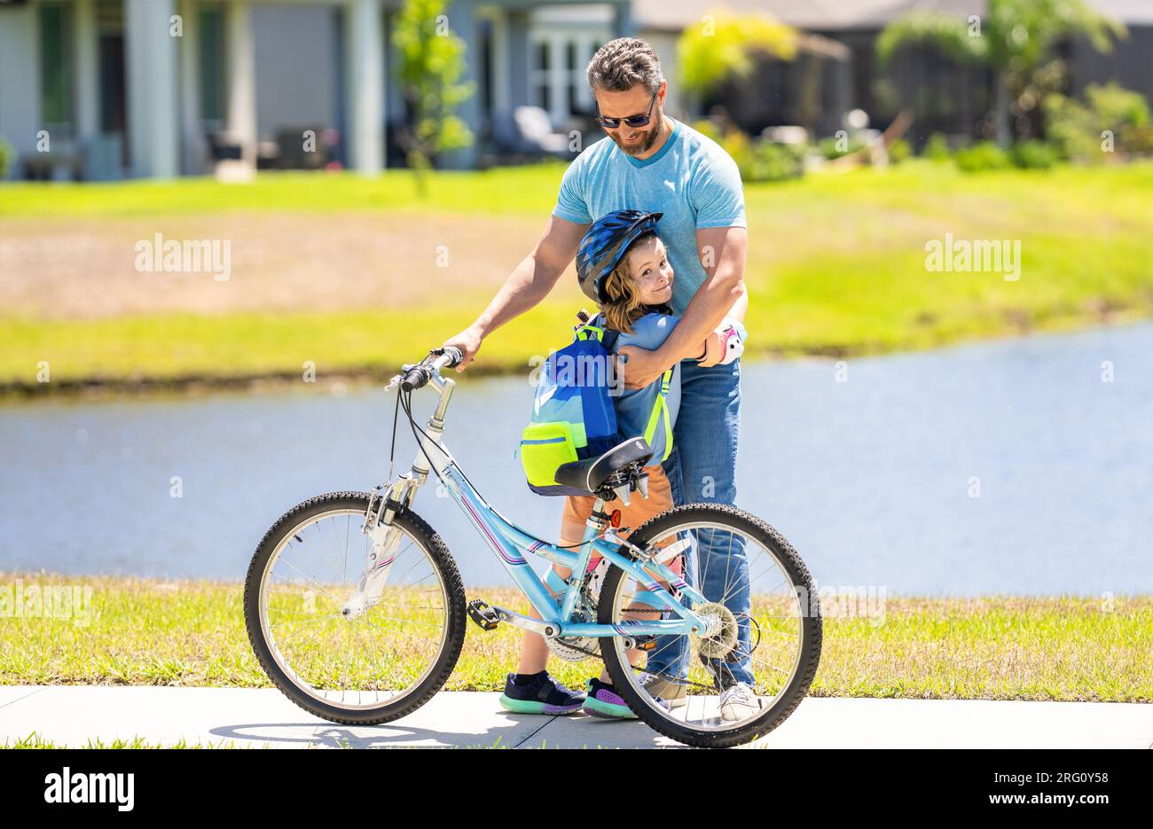 childhood of son supported by fathers care. father embrace son on ...