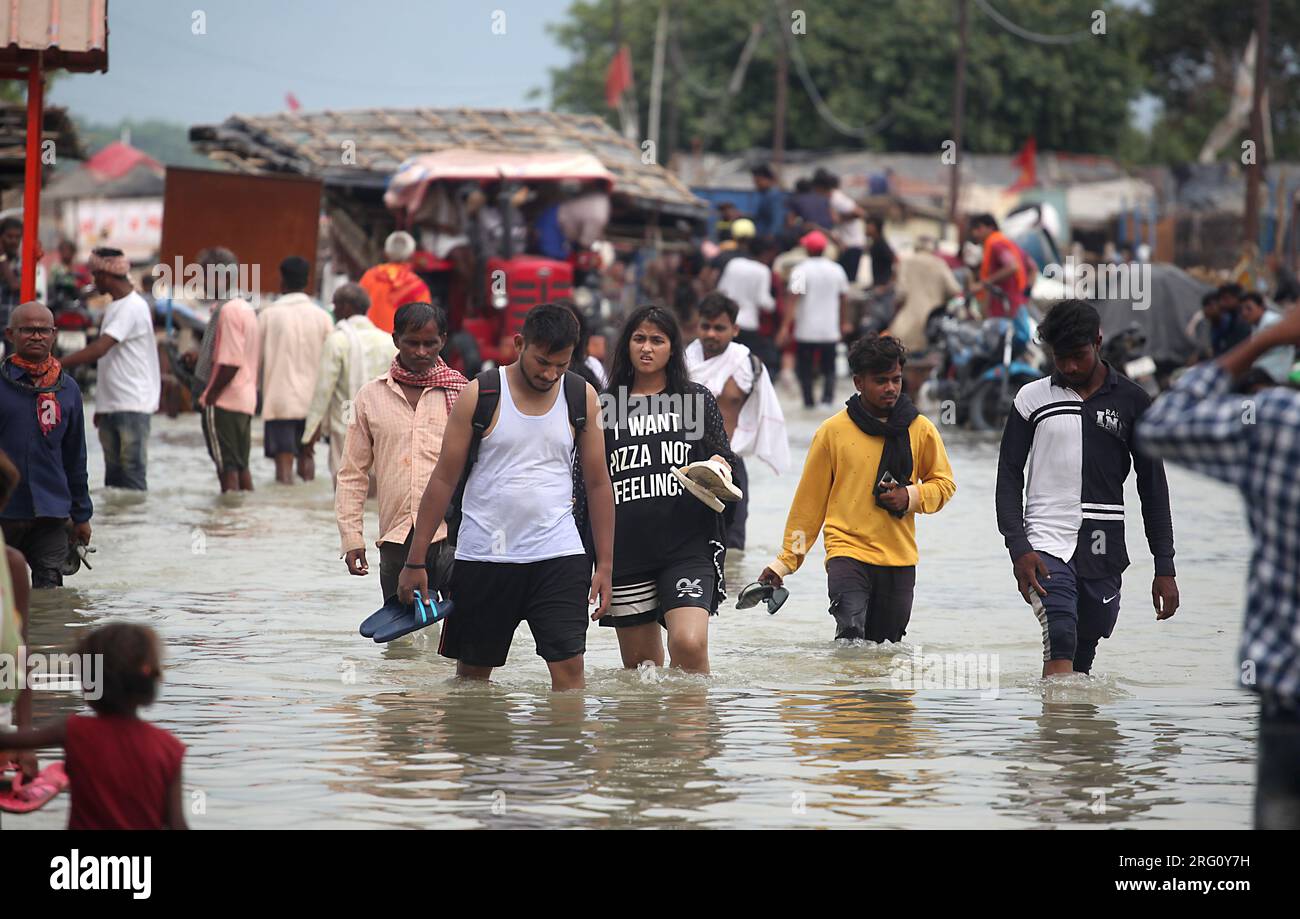 People prepare to shift at a safer place as water level of river Ganges ...