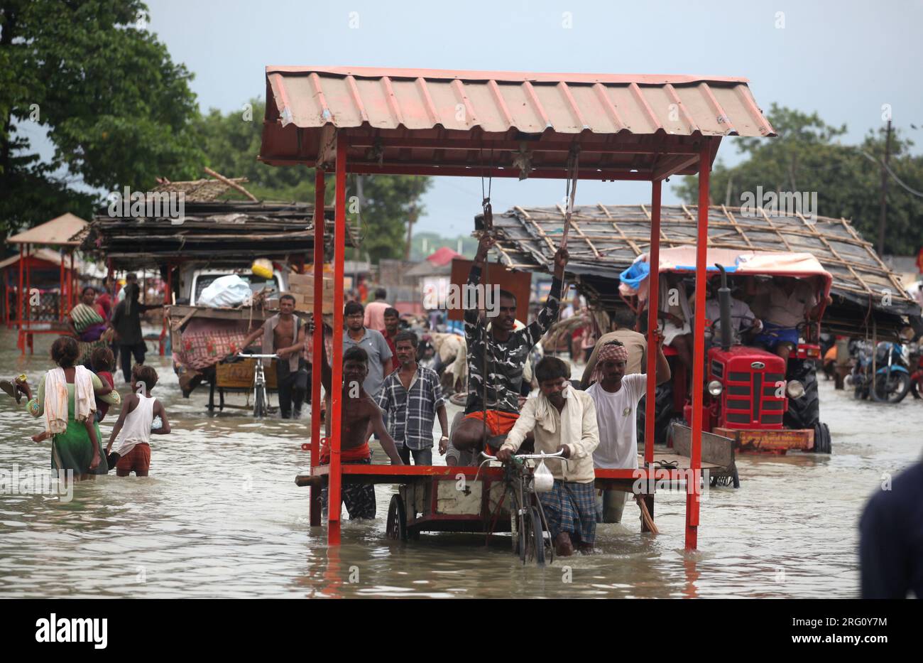 People prepare to shift at a safer place as water level of river Ganges ...