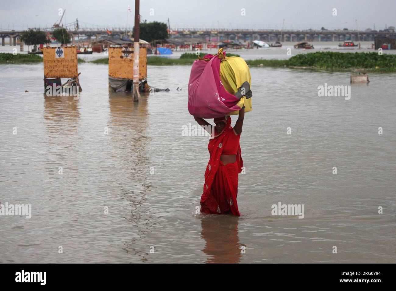 People prepare to shift at a safer place as water level of river Ganges ...