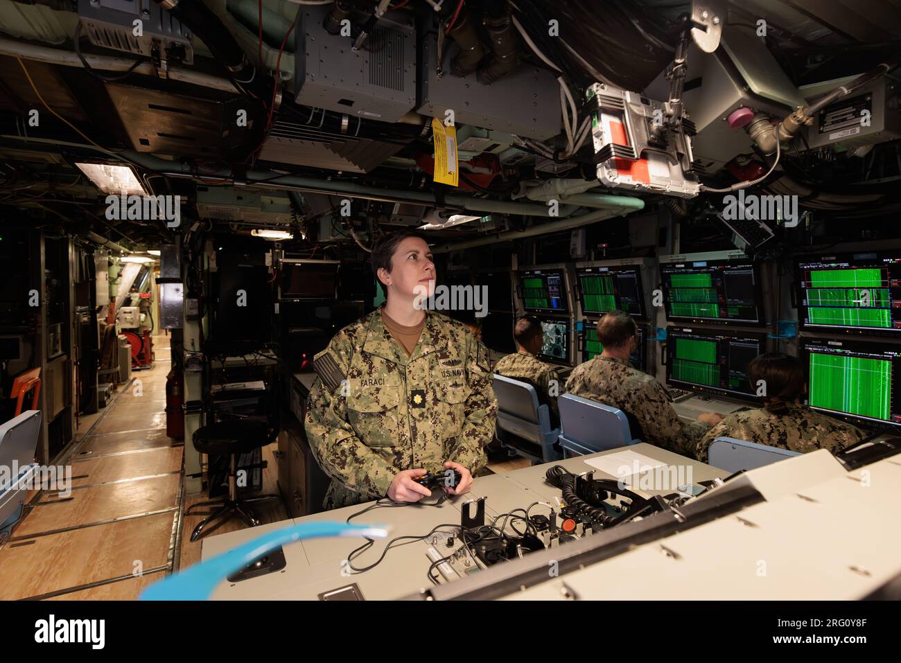 Lt. Cmdr. Christina Faraci, an Engineer is seen at the Conn in the ...