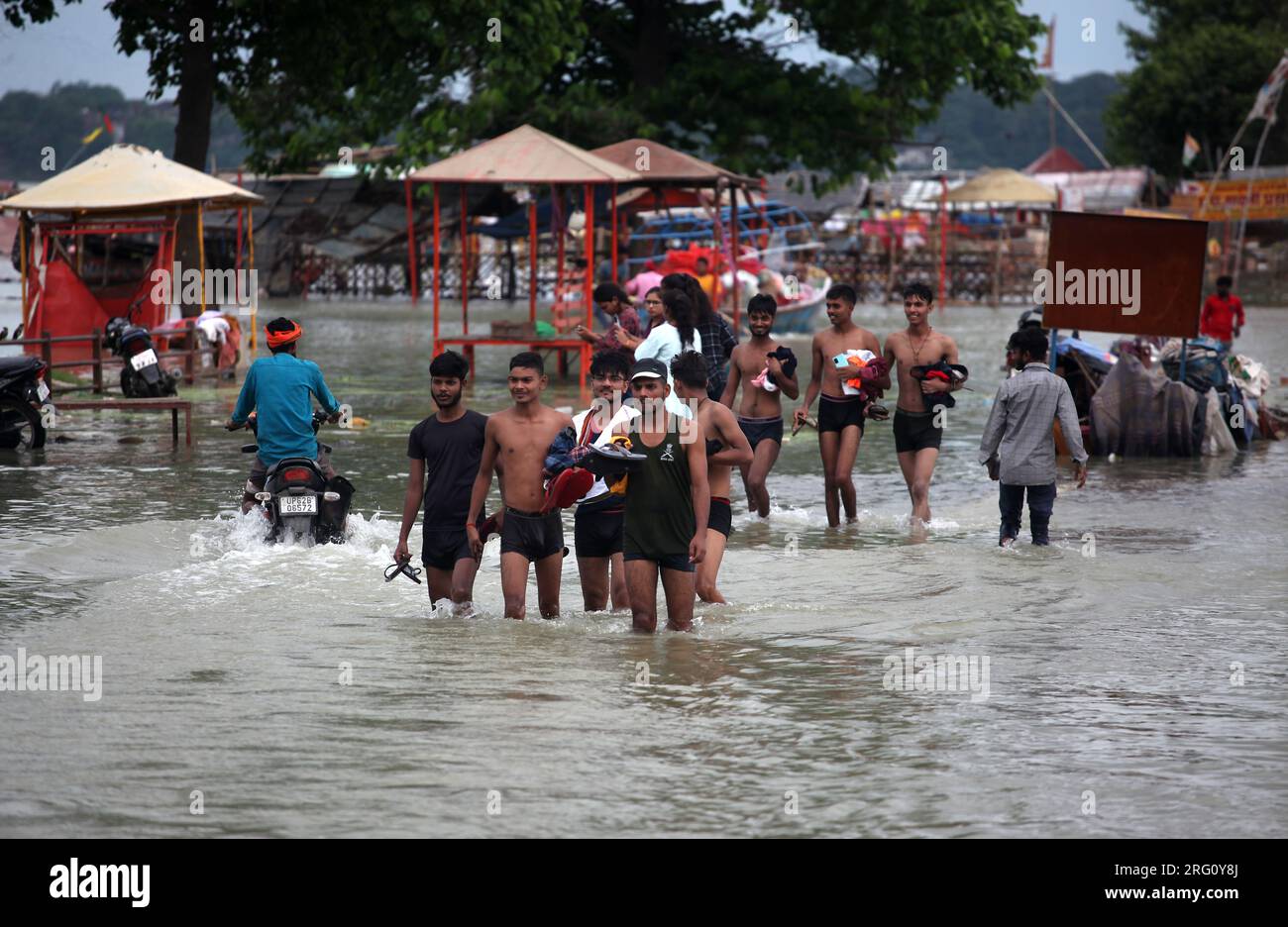 People prepare to shift at a safer place as water level of river Ganges ...
