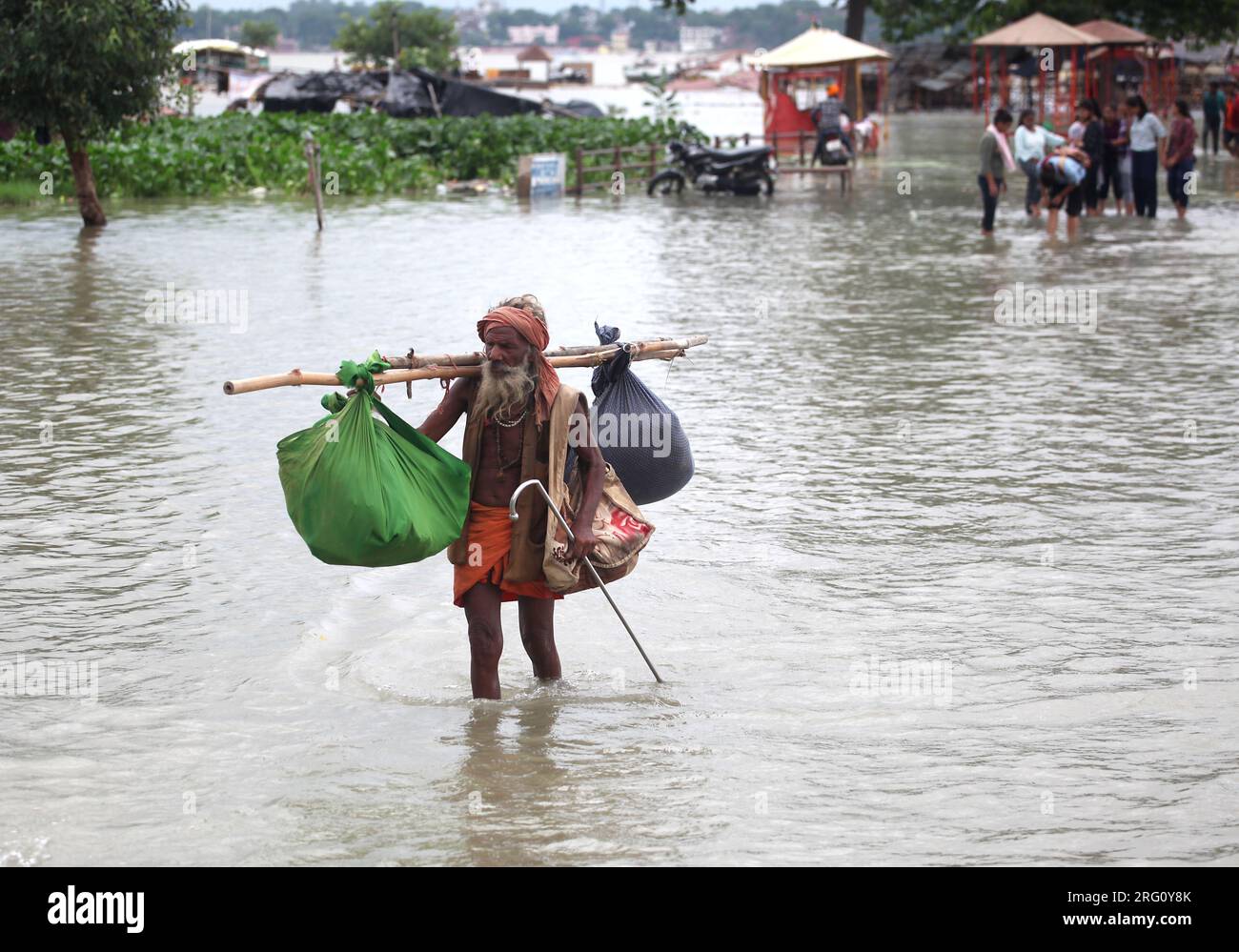 People prepare to shift at a safer place as water level of river Ganges ...