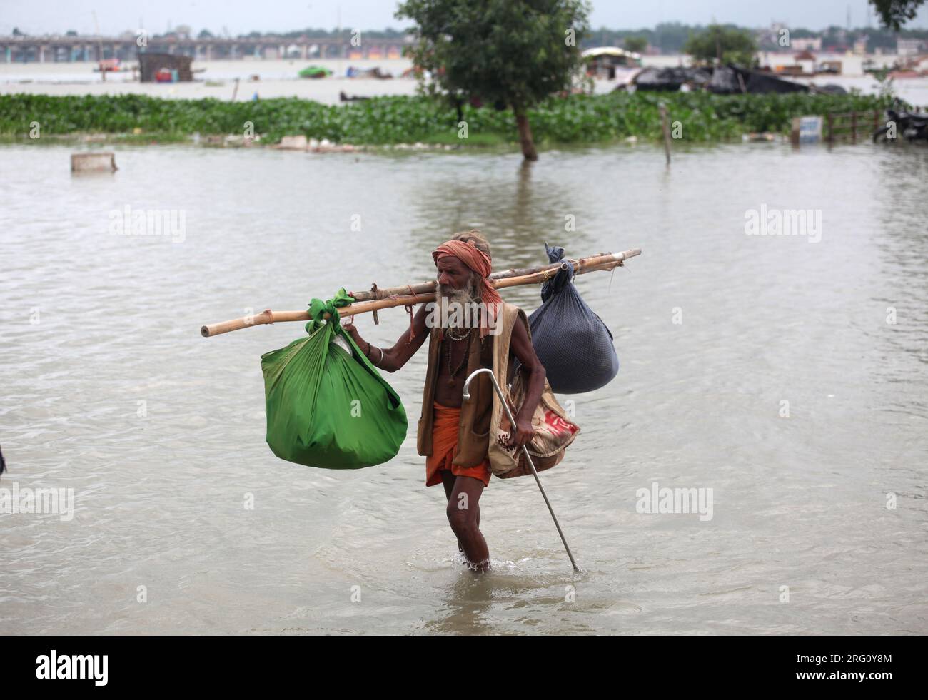 People prepare to shift at a safer place as water level of river Ganges ...
