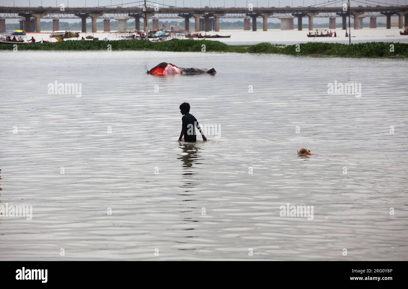 People prepare to shift at a safer place as water level of river Ganges ...