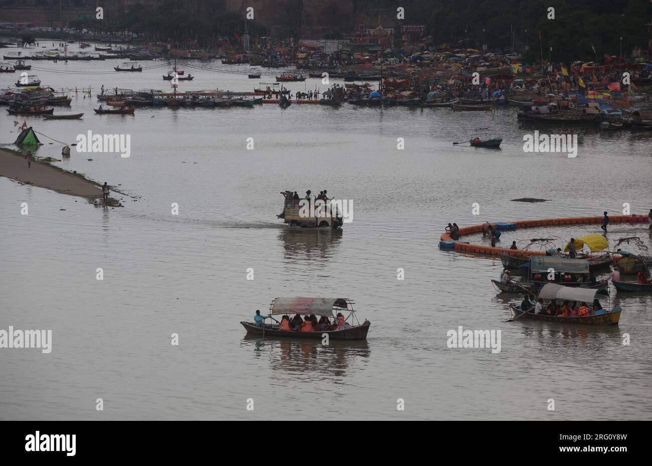 People prepare to shift at a safer place as water level of river Ganges ...