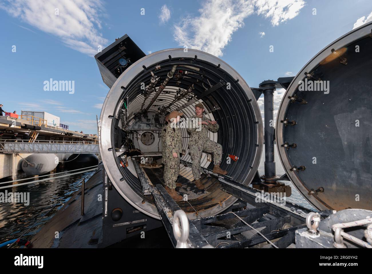 Crew members are seen in the dry dock shelter onboard the USS North ...