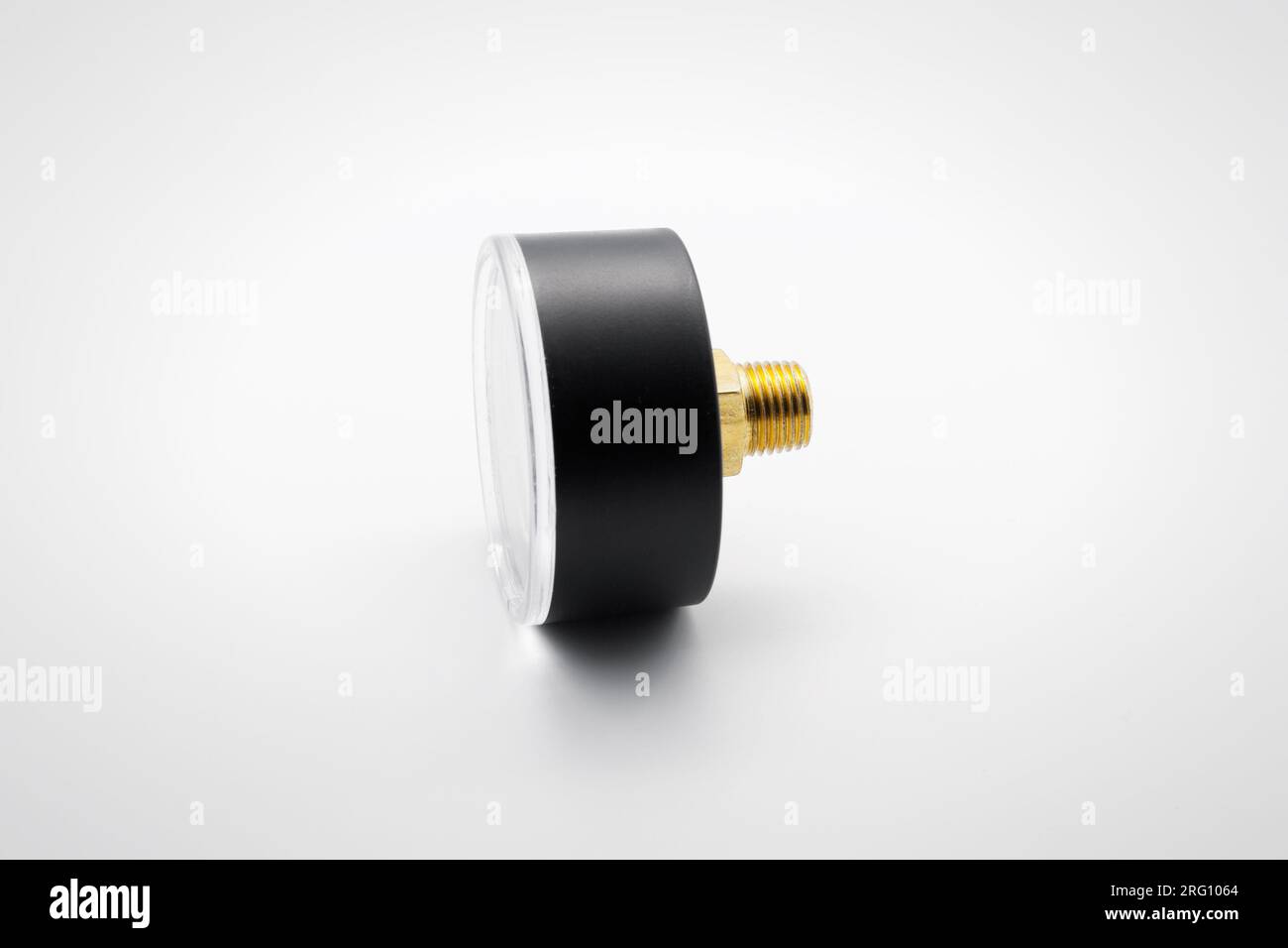 Small pressure gauge. Close-up. On white background Stock Photo - Alamy