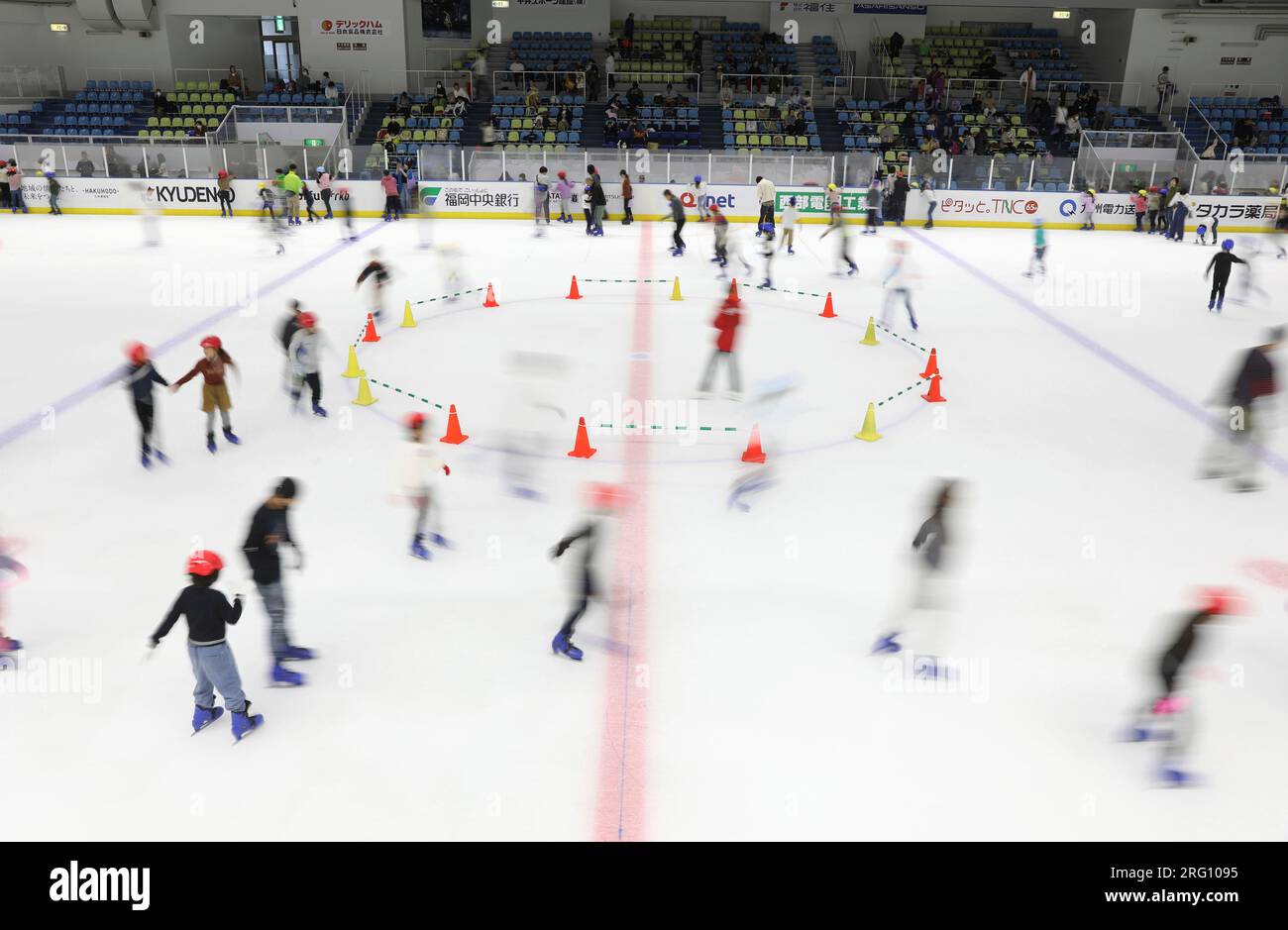 A skating rink is crowded with children at O-vision Ice Arena Fukuoka ...