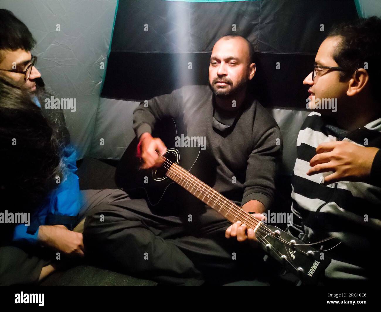 October 14th 2022, Uttarakhand India. Joyful friends bonding over booze ...