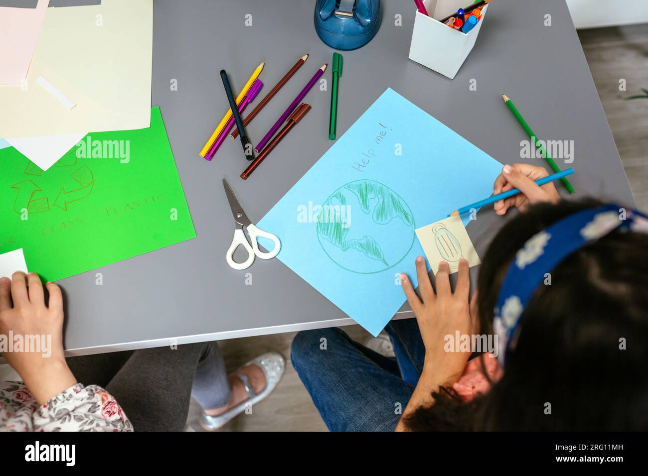 Top view of unrecognizable young female student drawing concepts about ...