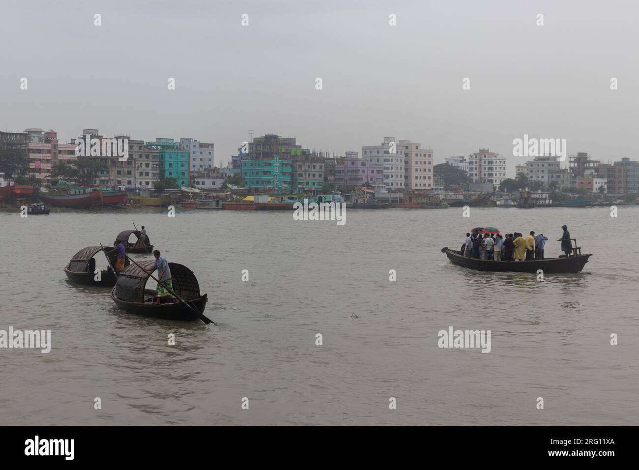 Narayanganj, Dhaka, Bangladesh. 7th Aug, 2023. Residents cross over the ...