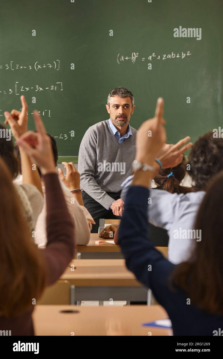 Math teacher giving lessons. Classroom with students. School education ...