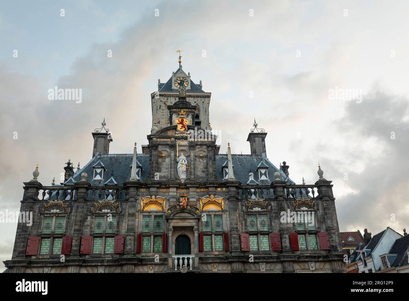 Medieval historical town hall of Delft during sunset with clouds Stock ...