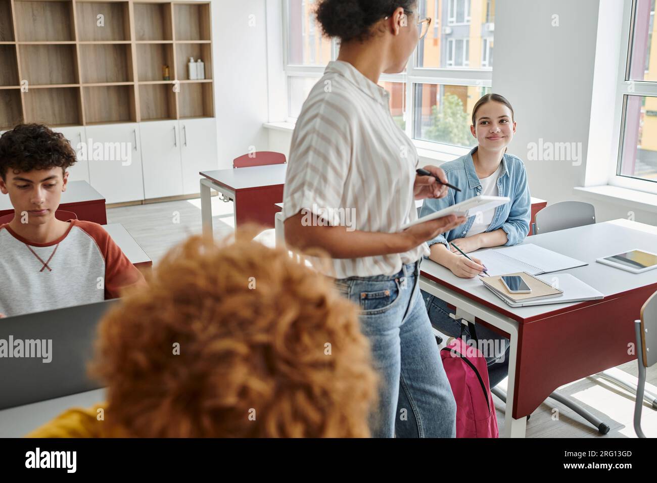 Girl students looking tablets hi-res stock photography and images - Alamy