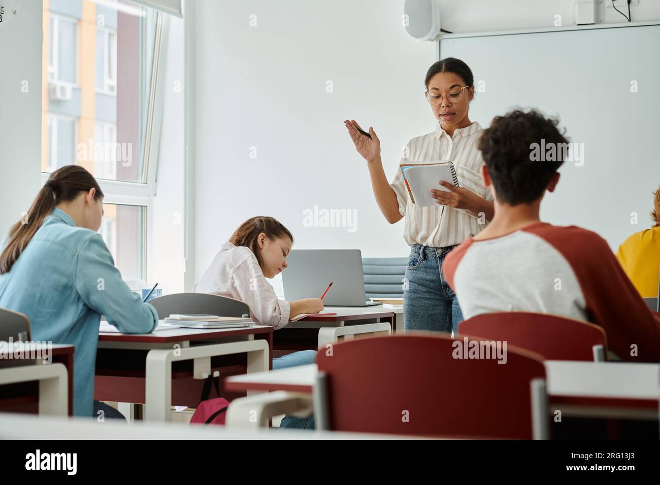 Teen girls talking class hi-res stock photography and images - Alamy