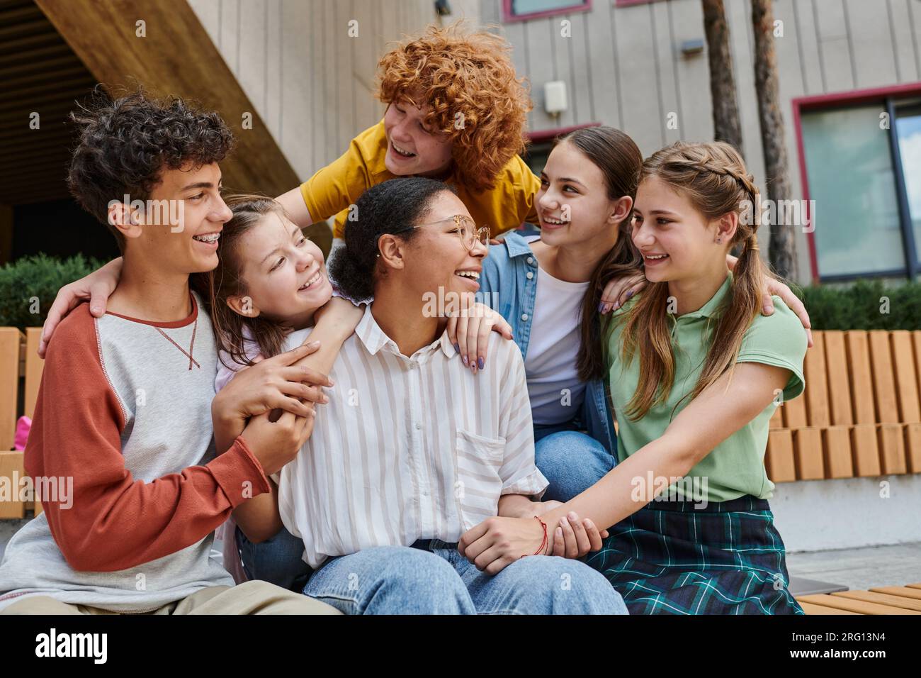 cultural diversity, back to school happy african american woman hugging ...