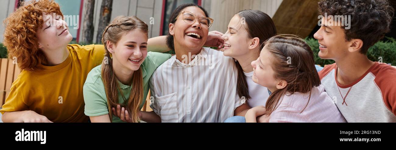 banner, happy african american woman hugging with teenage students ...