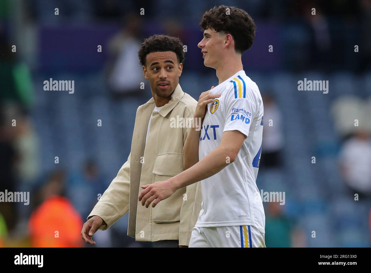 Tyler Adams #12 of Leeds United speaks with Archie Gray #22 of Leeds ...