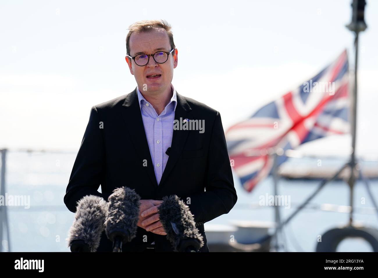 Queensland Consul-General Richard Cowin speaks to the media from aboard ...
