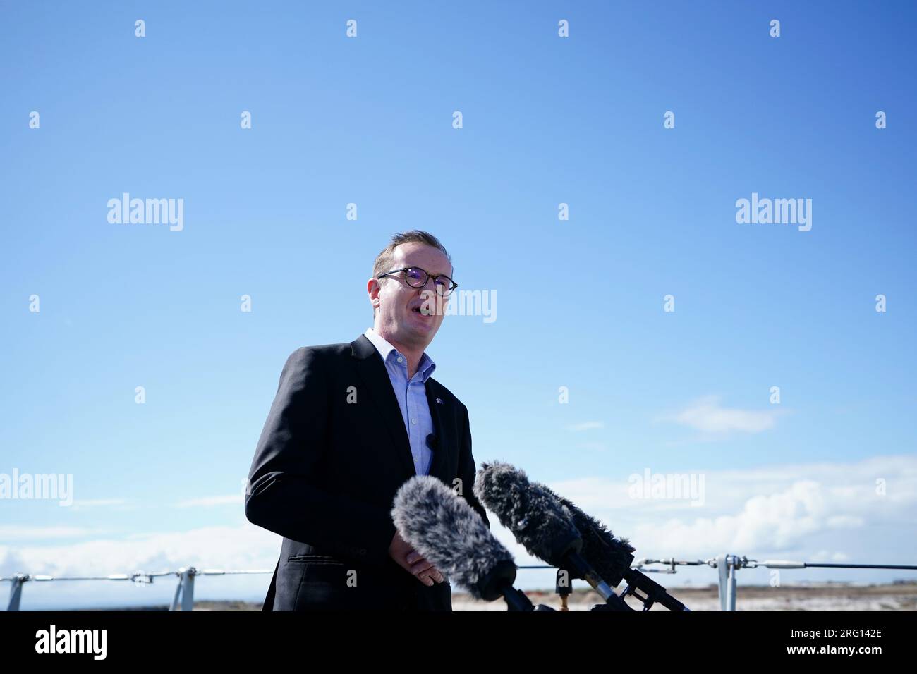 Queensland Consul-General Richard Cowin speaks to the media from aboard ...