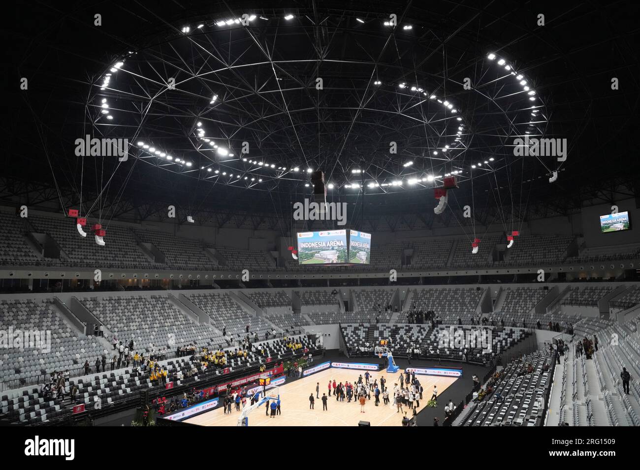People gather during an inauguration of a new venue, Indonesia Arena in ...