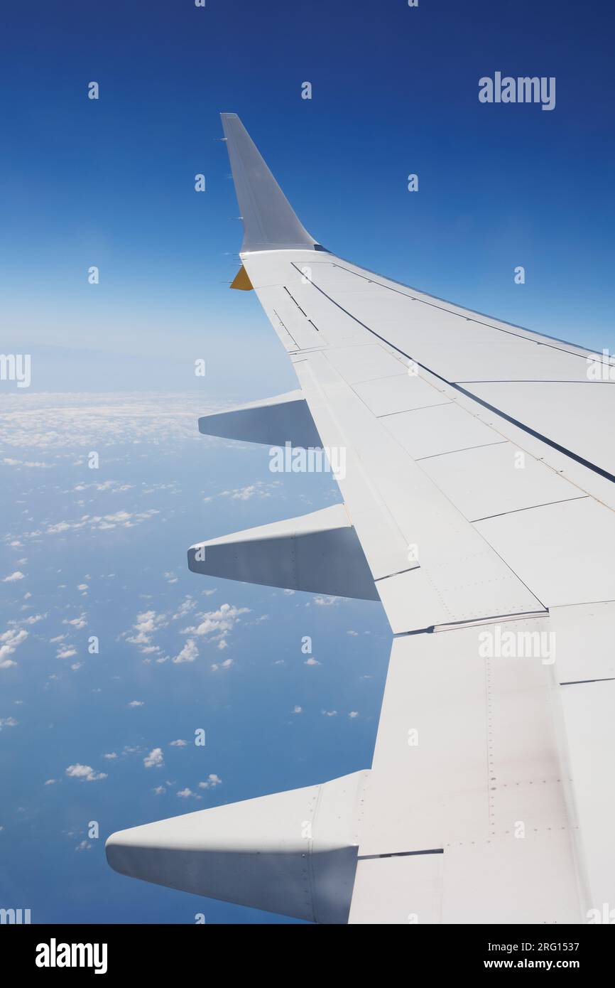 View from Inside an Aircraft: Window of the Cabin, White Airplane Wing ...