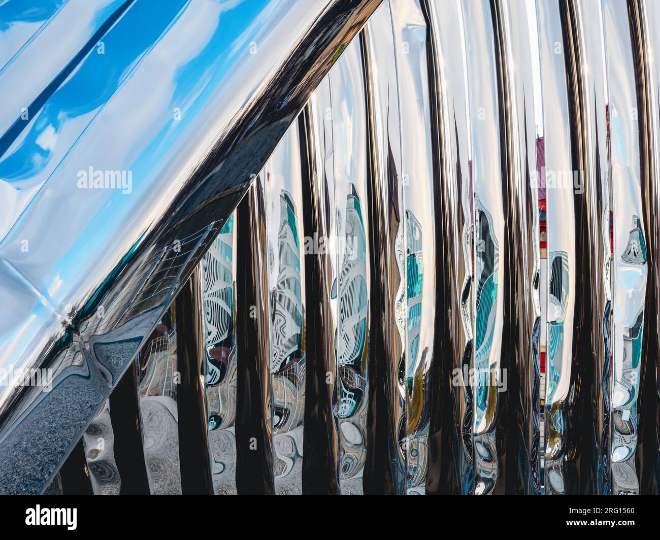 Abstract modern urban metal structure in a row in boomerang curved bent ...