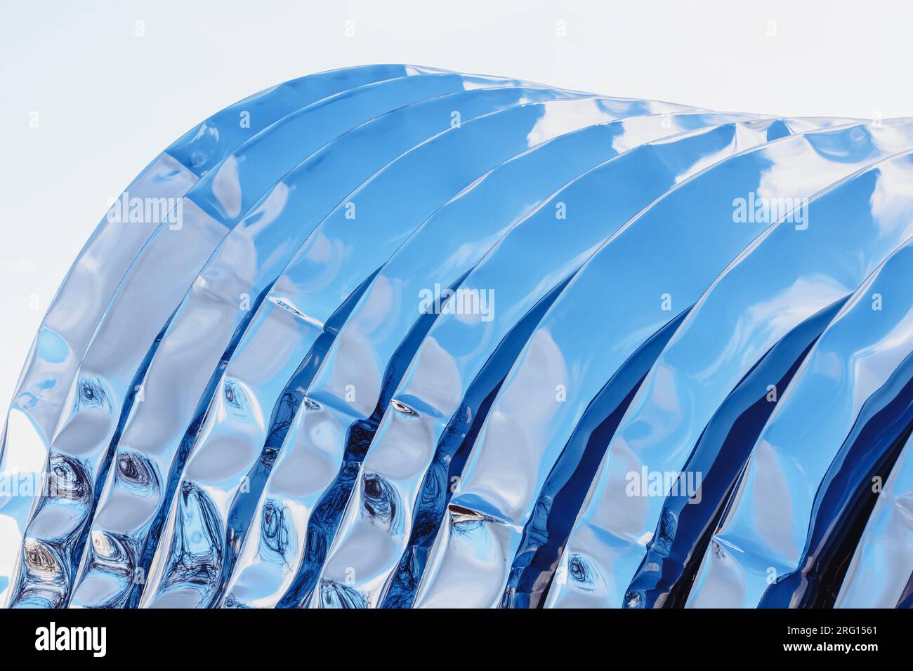 Abstract modern urban metal structure in a row in boomerang curved bent ...